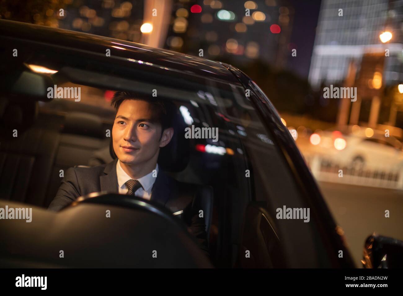 Successful Chinese businessman driving car Stock Photo - Alamy