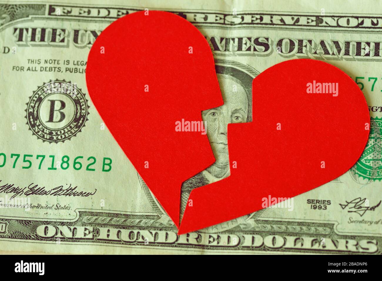 Broken heart on dollar banknote - Concept of love and money ...