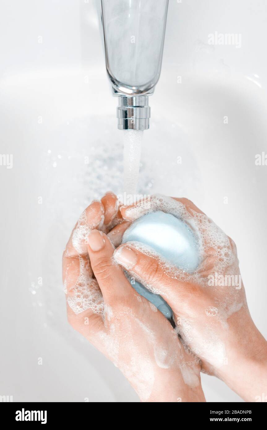 Hand washing concept: woman soaping her hands before a complete hand ...