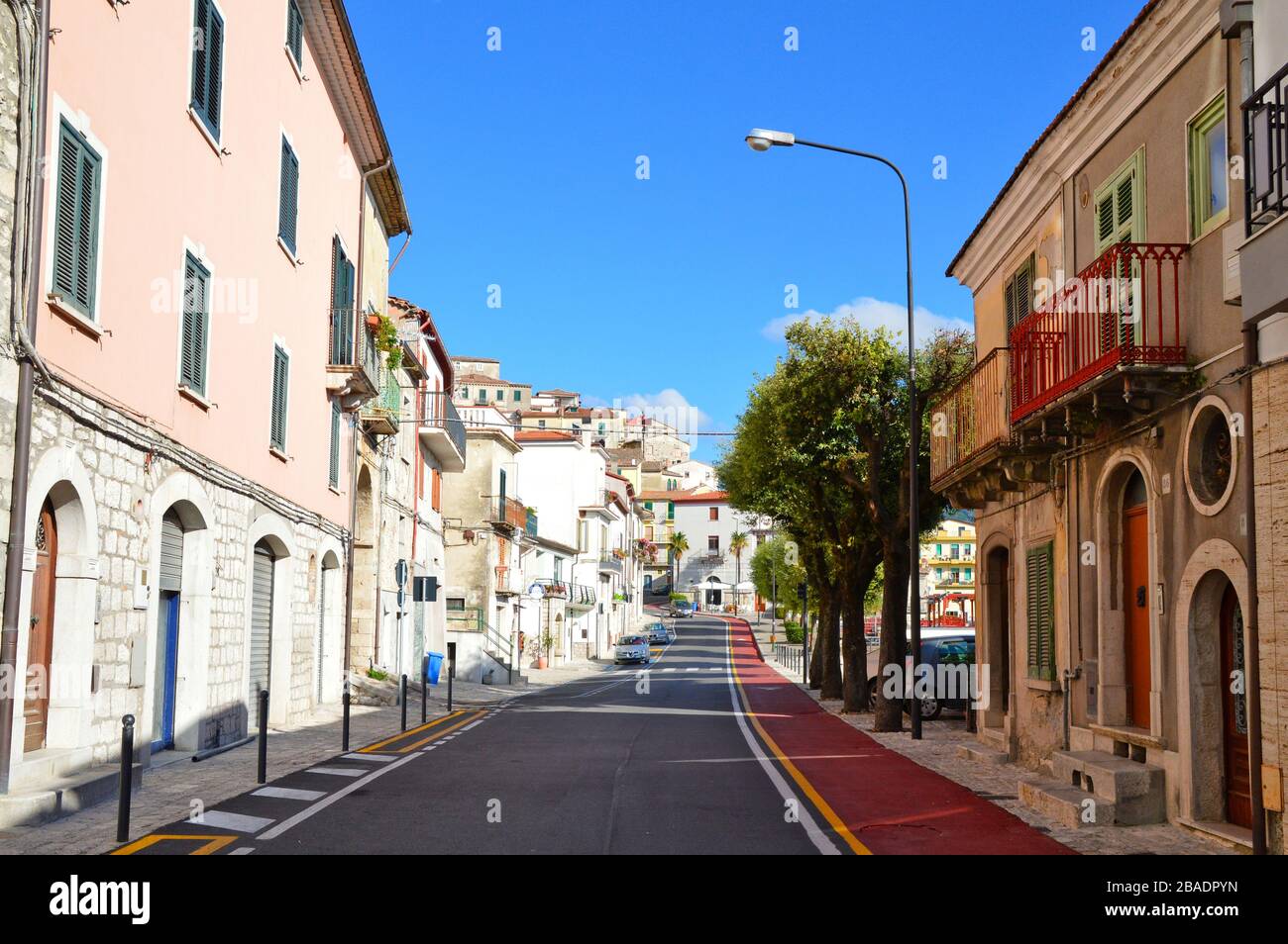 A narrow street between the houses of Morcone, a medieval village in ...