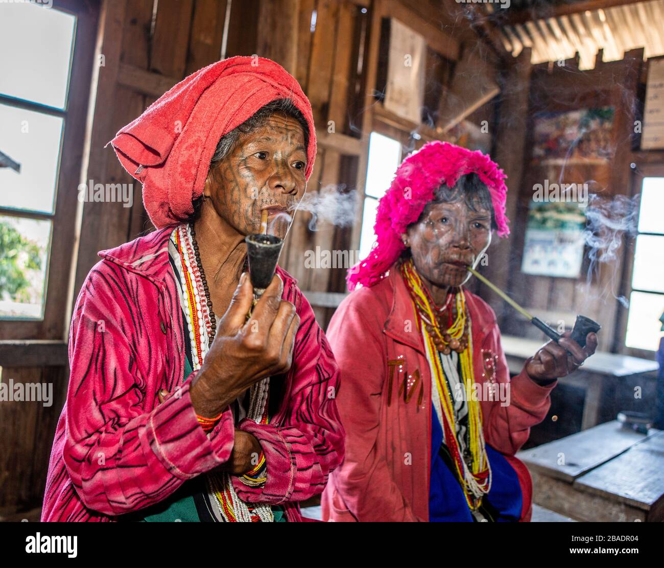 Two Chin women in traditional clothes smoke a pipe. 16 February, 2019 ...