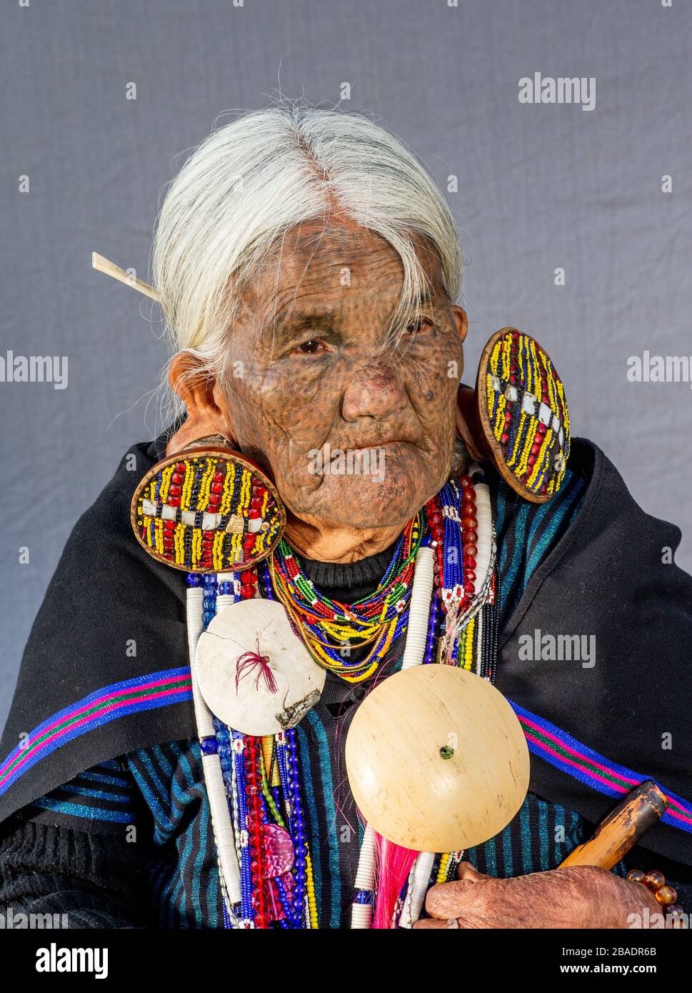 Portrait of an old chin woman in traditional dress with traditional ...