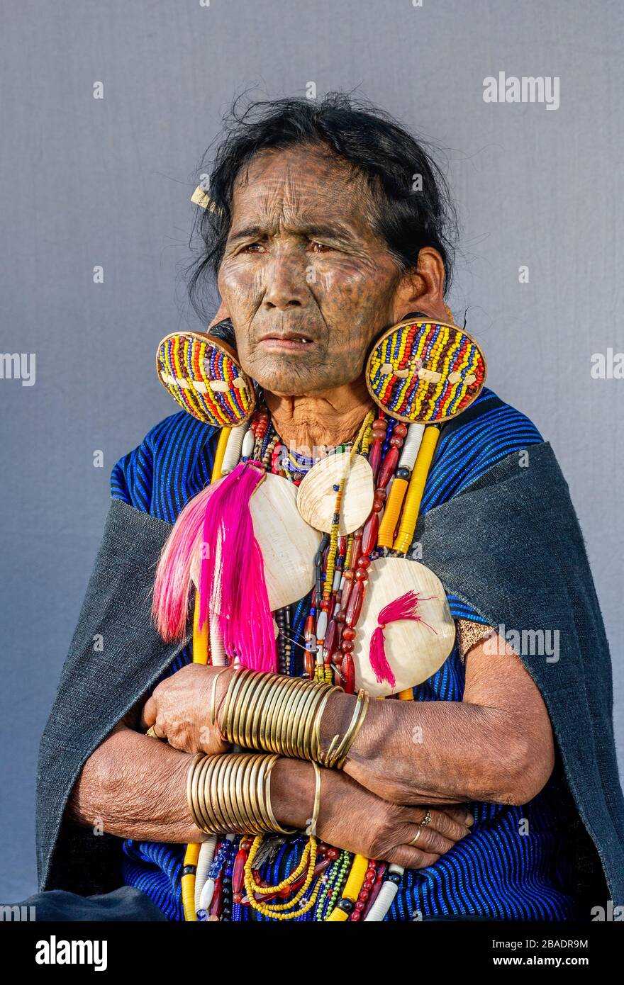 Portrait of an old chin woman in traditional dress with traditional ...