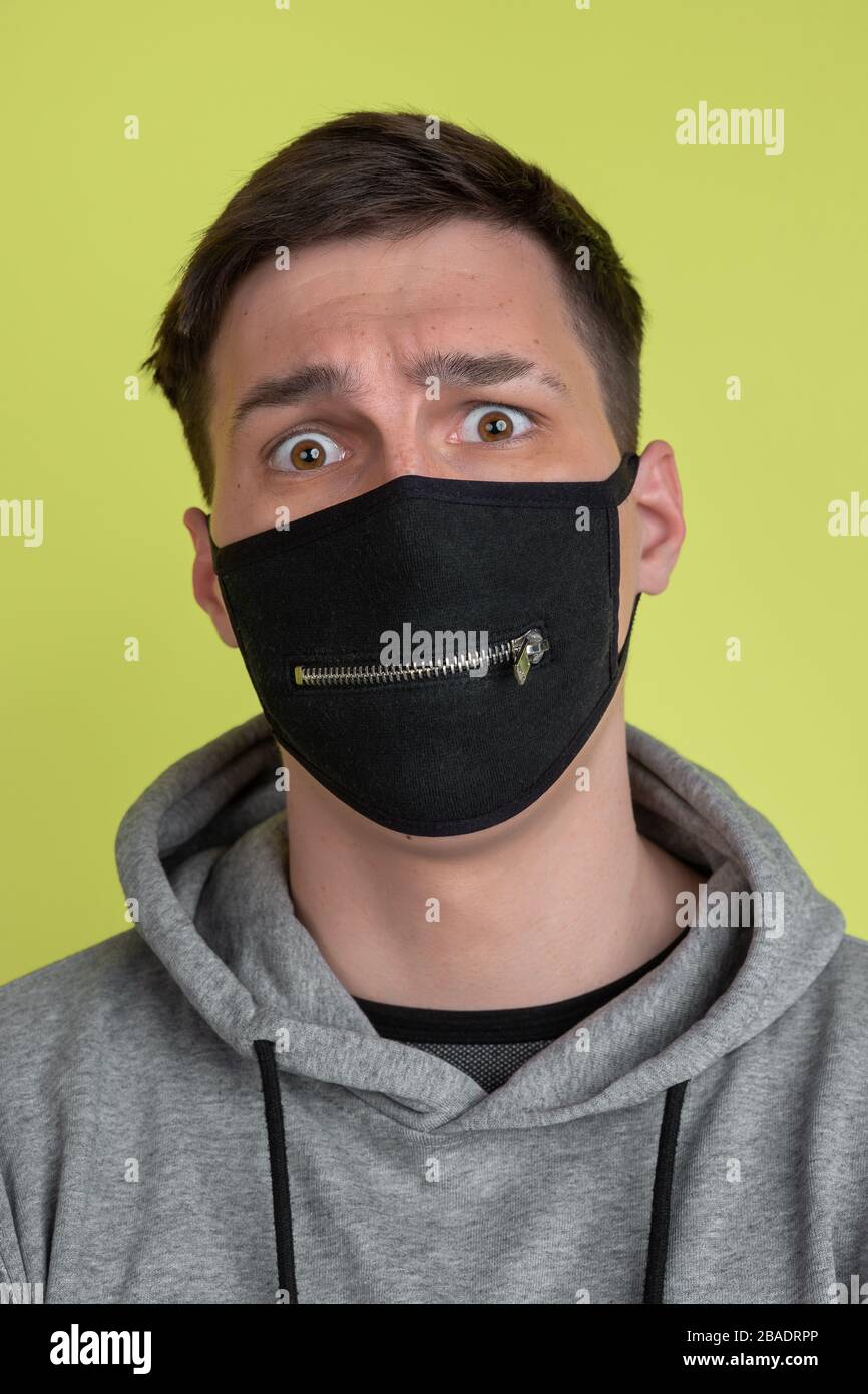 Scared eyes. Caucasian man's portrait isolated on yellow studio ...