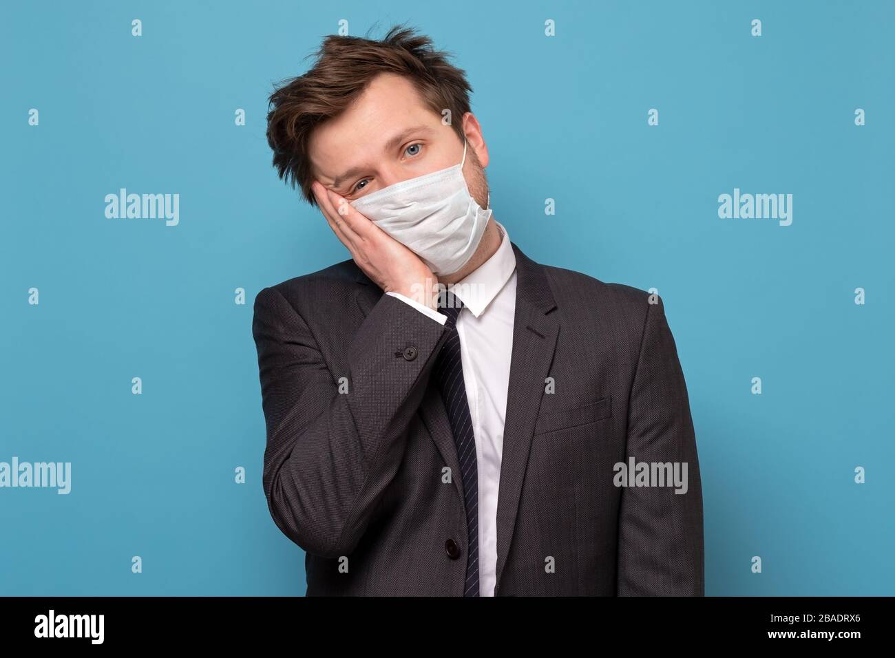 Middle age caucasian man in medical mask is depressed and worry for ...