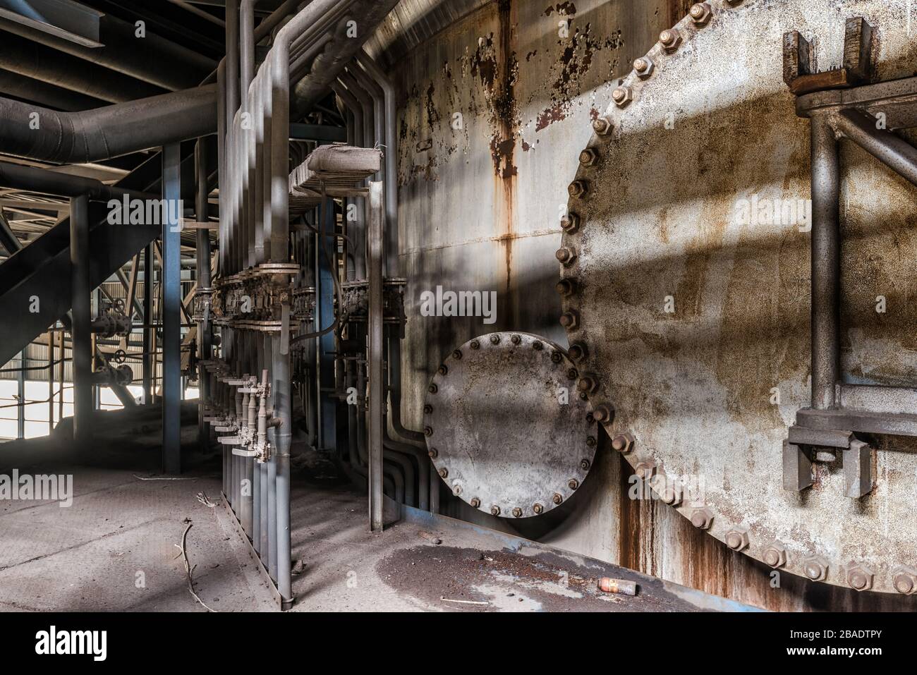 Interior of an old abandoned industrial steel factory Stock Photo - Alamy