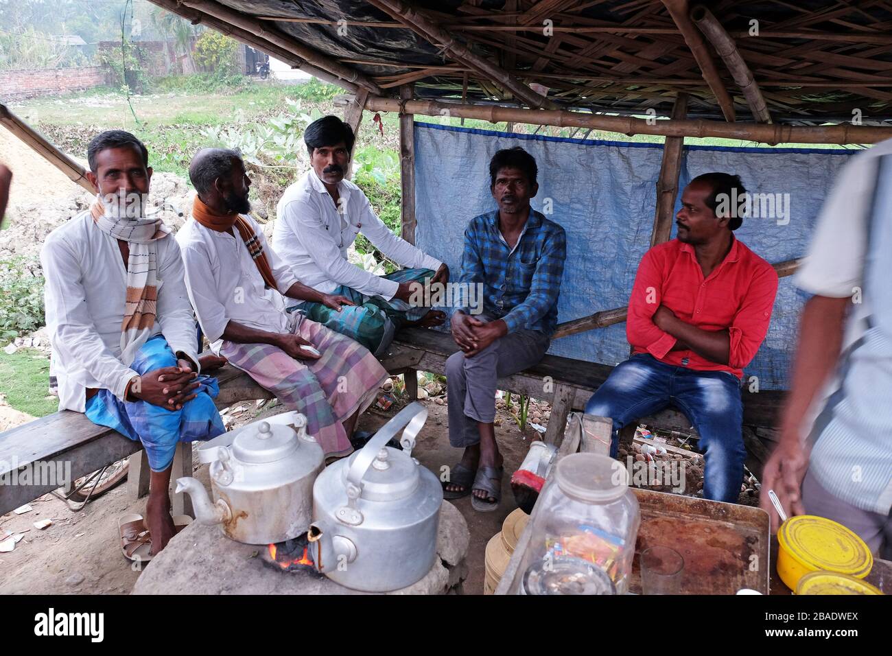 Indian men in a typical tea house in Kumrokhali village, West Bengal ...