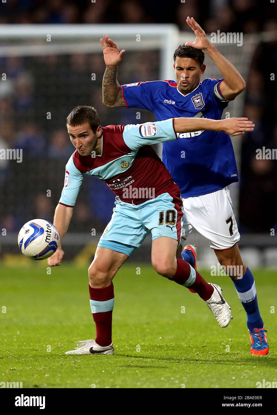 Ipswich Town's Carlos Edwards and Burnley's Martin Paterson battle for ...