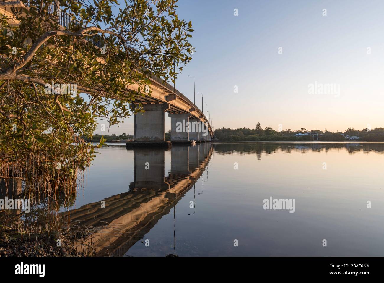 Morning sun on the Singing Bridge between the towns of Tea Gardens and ...