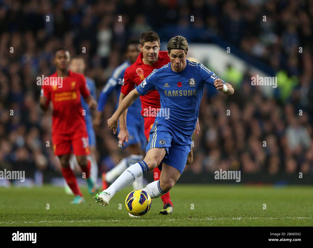 Chelsea's Fernando Torres (right) and Liverpool's Steven Gerrard (back ...