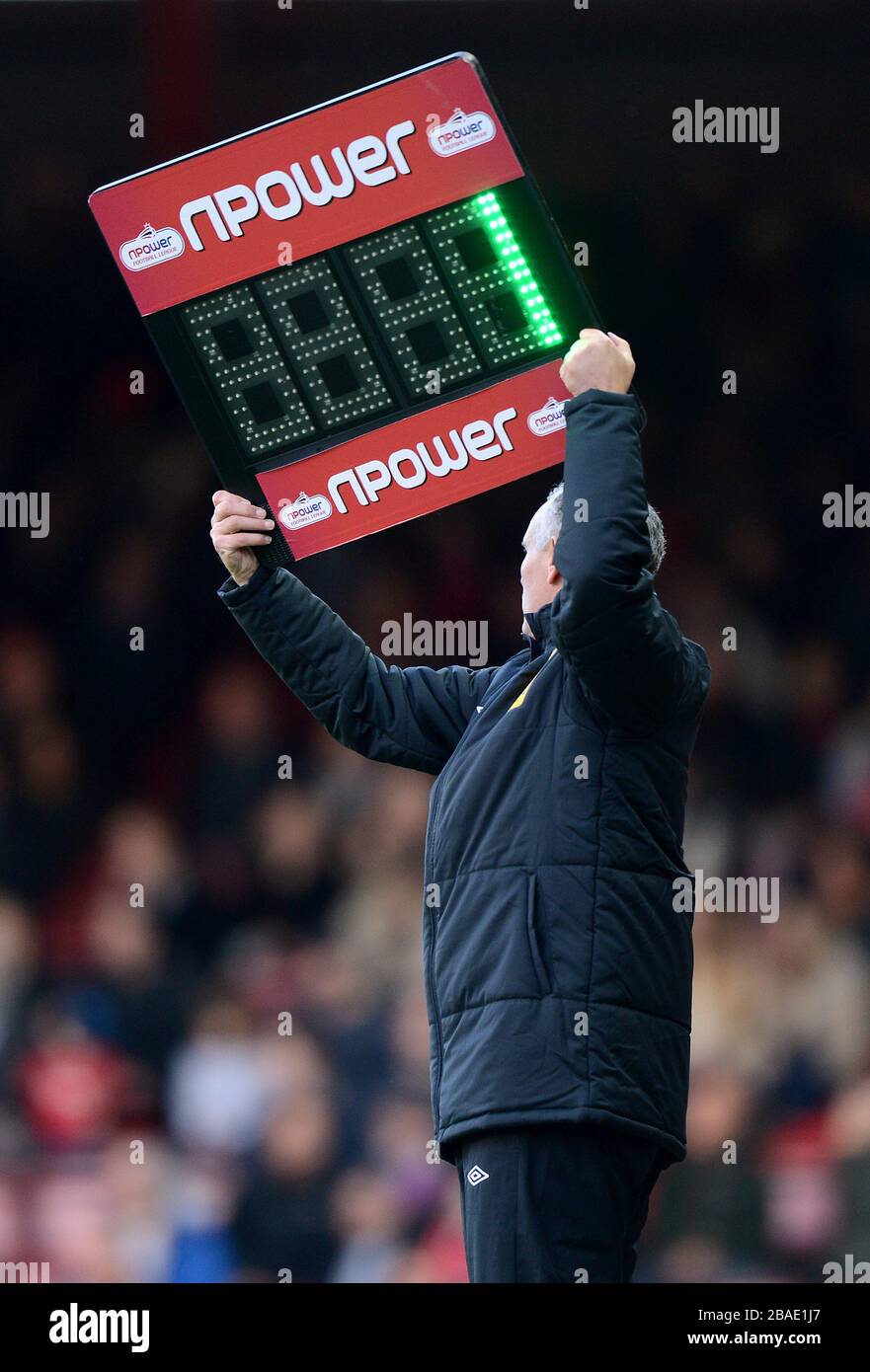 Detail of a match official holding up an electronic board signalling ...