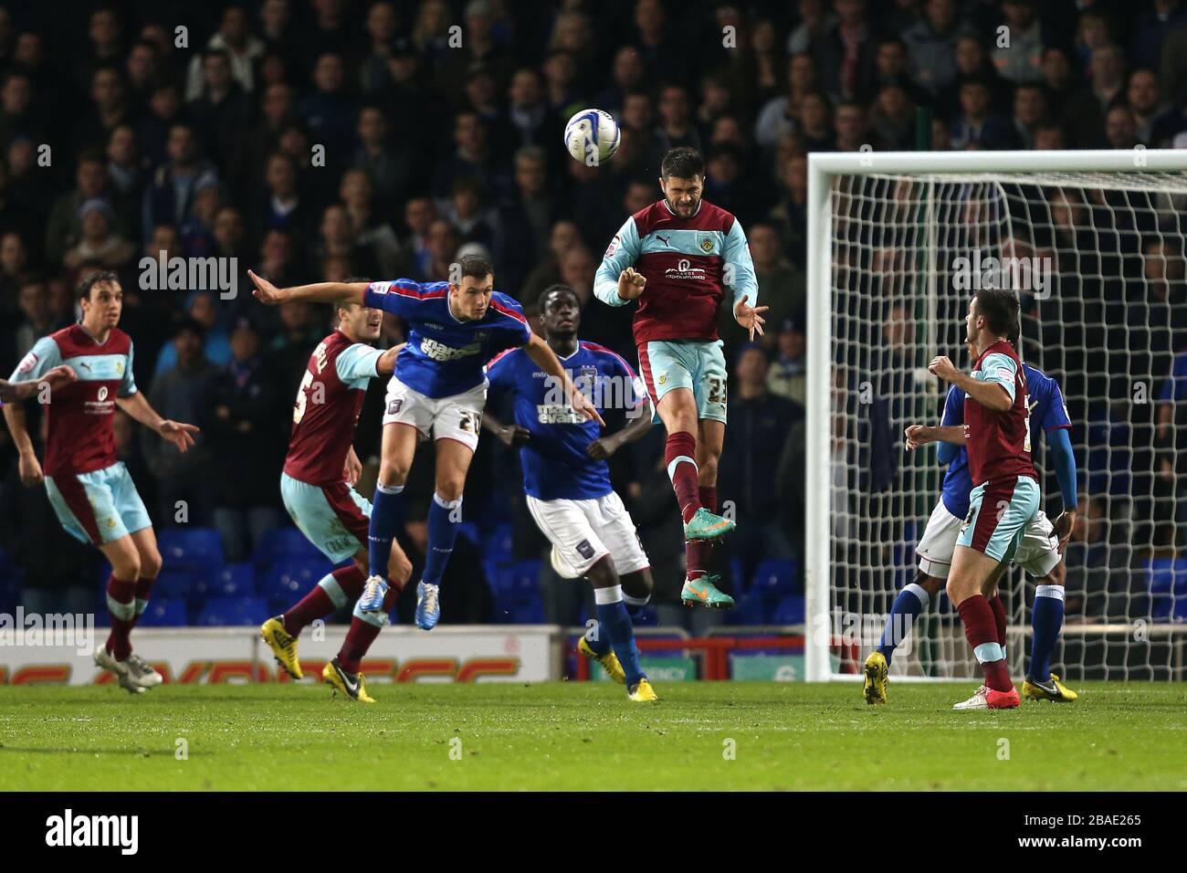 Burnley's Charlie Austin clears the ball under pressure Stock Photo - Alamy