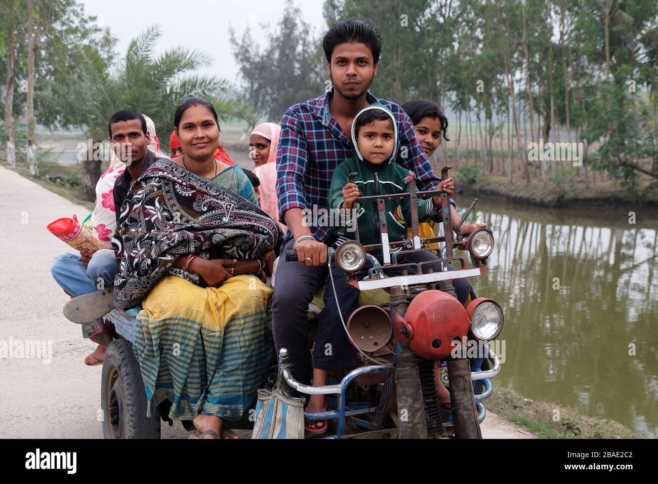 Indian tricycle motor rickshaw carrying passenger, Kumrokhali, West ...