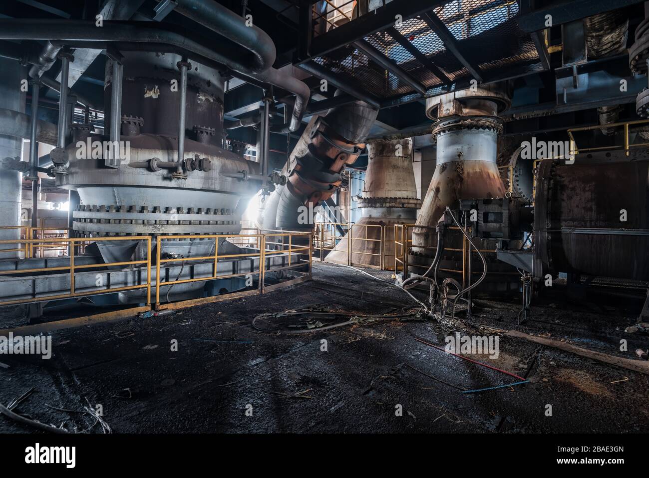 Interior of an old abandoned industrial steel factory Stock Photo - Alamy