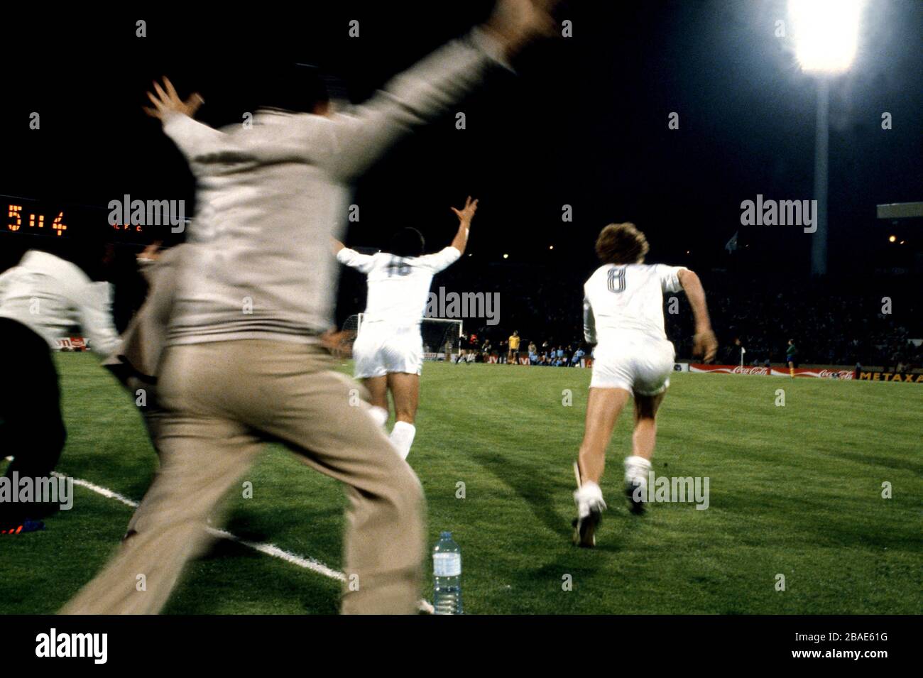 Valencia substitutes and coaches race onto the pitch in celebration ...