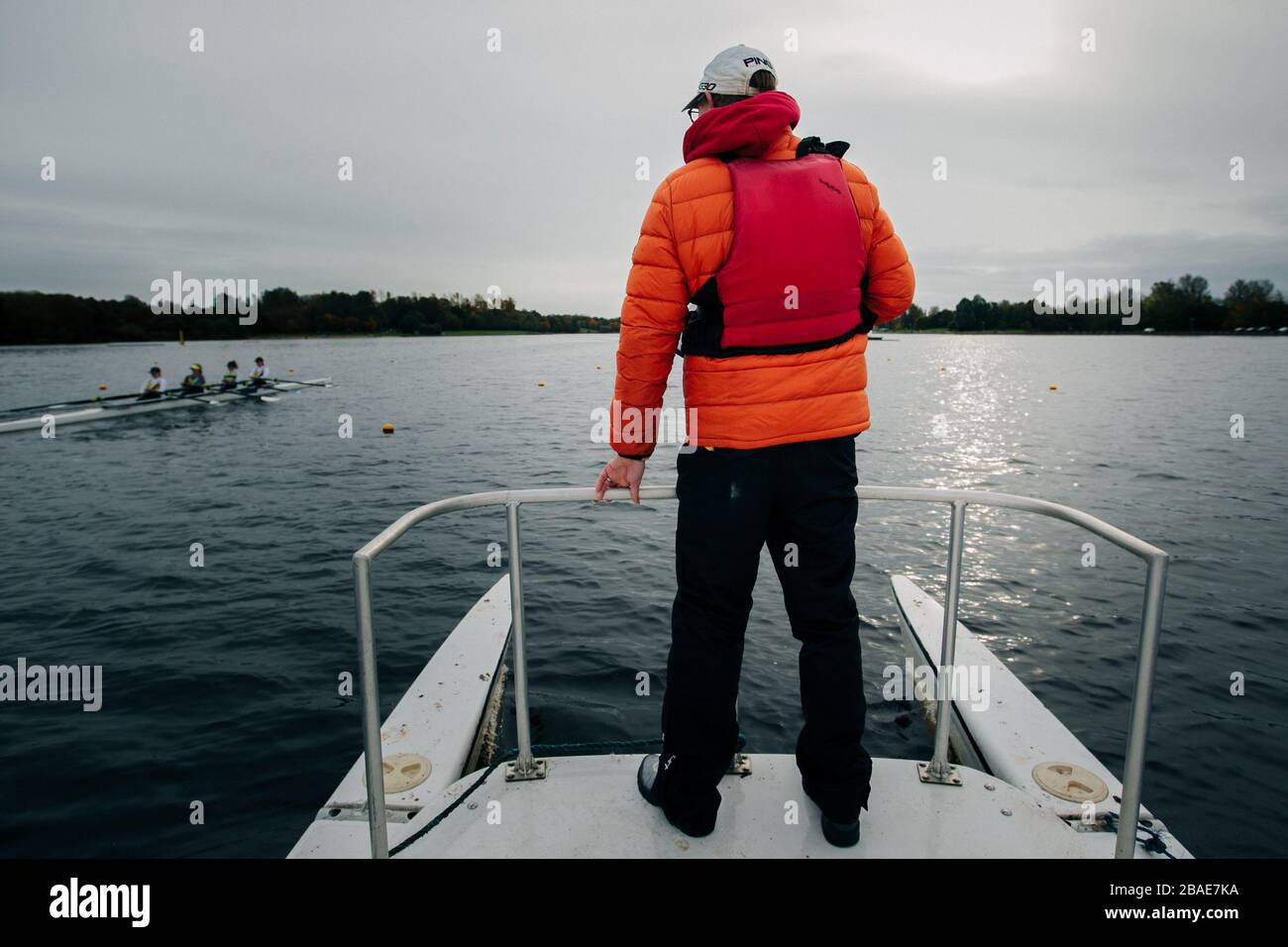 Rowing coach, with rowers in boat, at Strathclyde Park Loch / reservoir ...