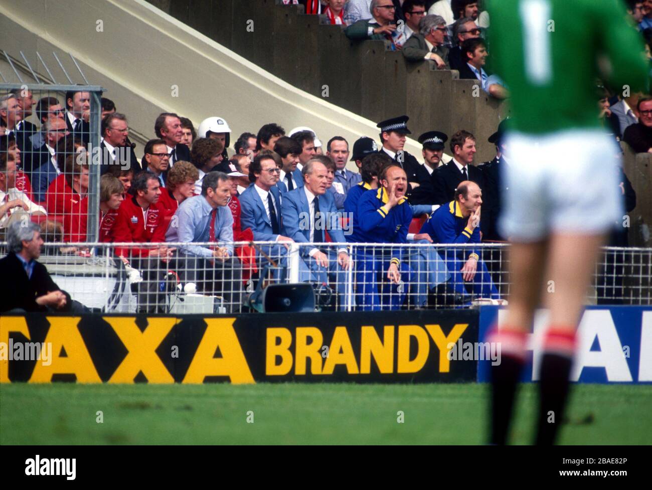 Manchester United manager Dave Sexton (third l) watches the game unfold ...