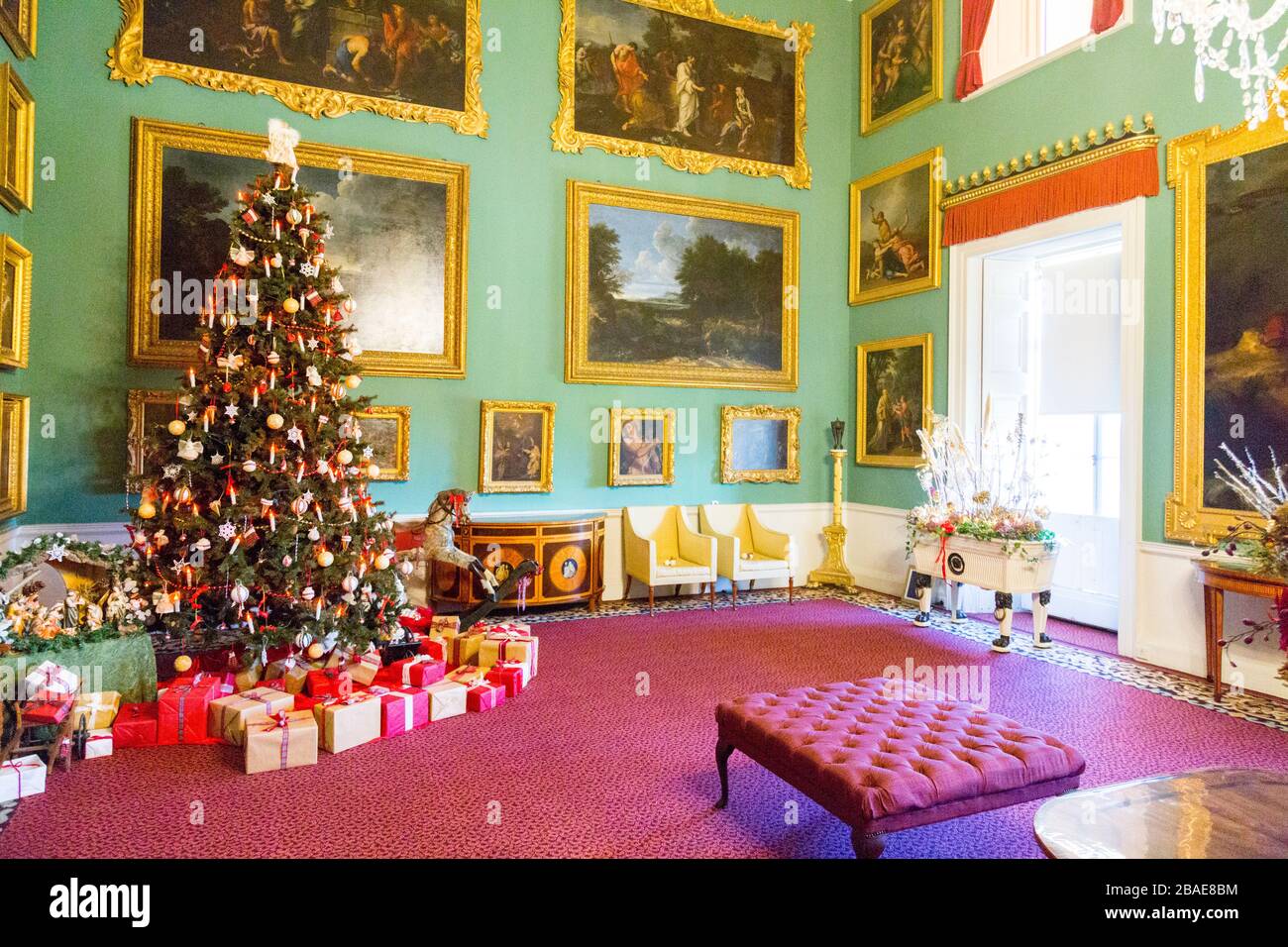 A beautifully decorated Christmas tree surrounded by carefully wrapped ...