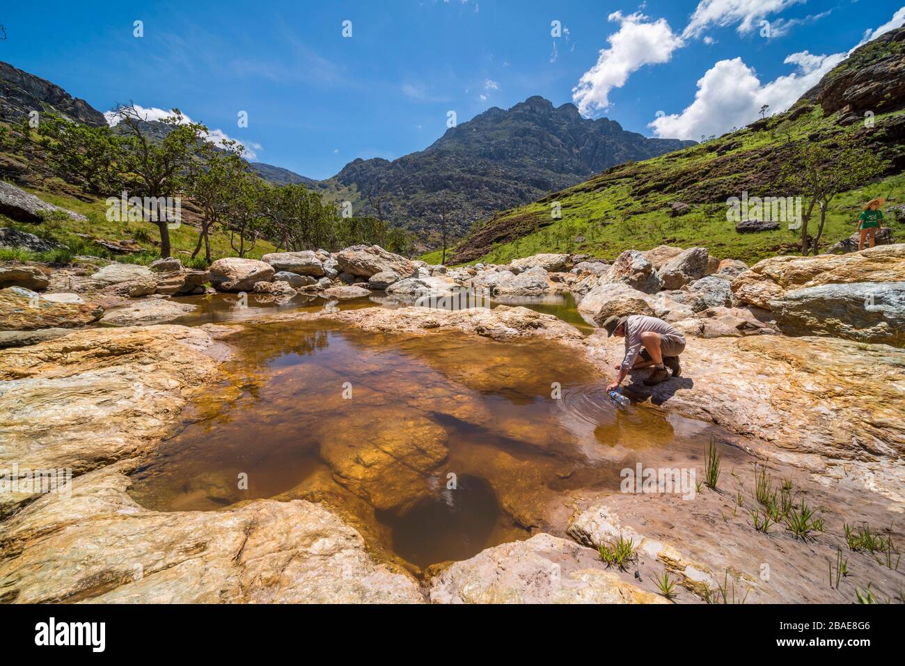 A large pool with a mountain backdrop in Zimbabwe's Chimanimnai ...