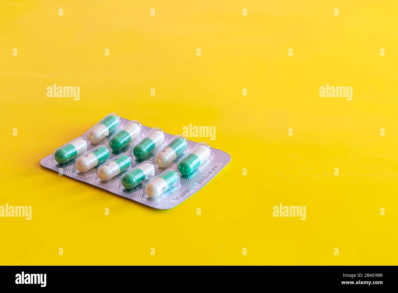 One blister of antidepressant tablets on spring yellow background with ...
