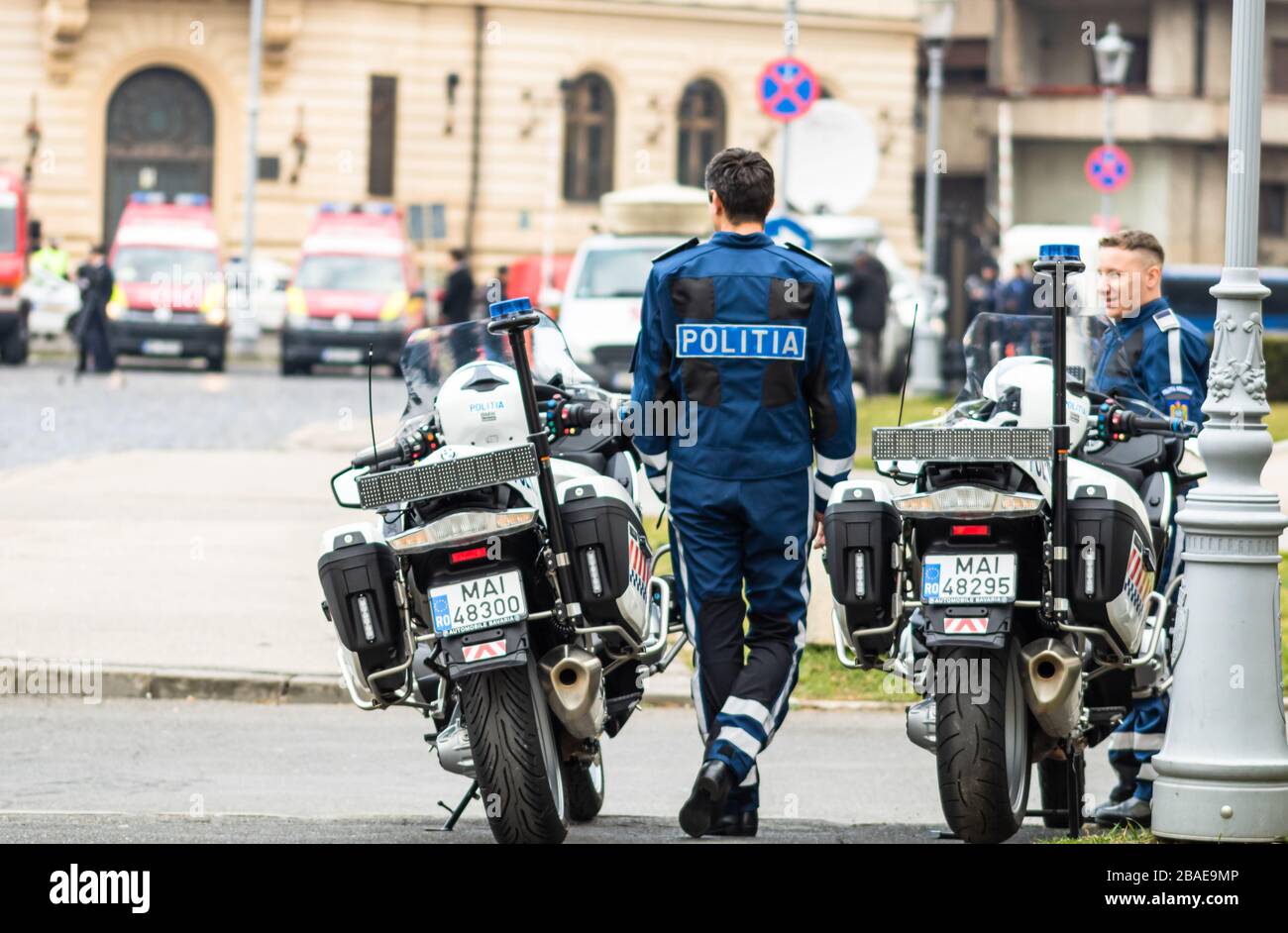 Police agent on motorcycle, Romanian Police (Politia Rutiera) car ...