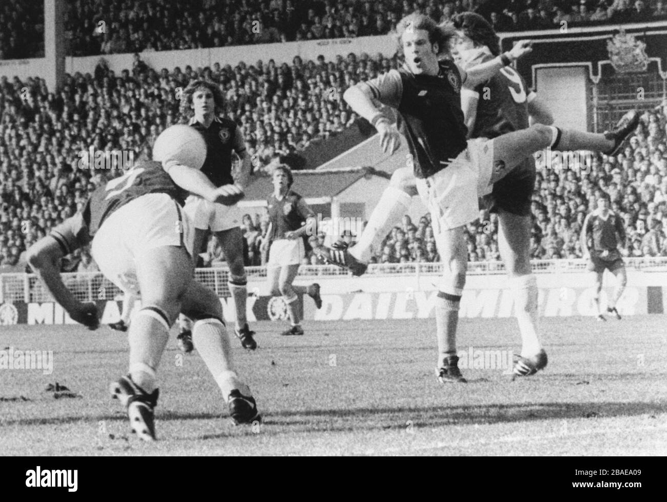 Chris Nicholl (l) clears an Everton attack as Andy Gray looks on (r ...