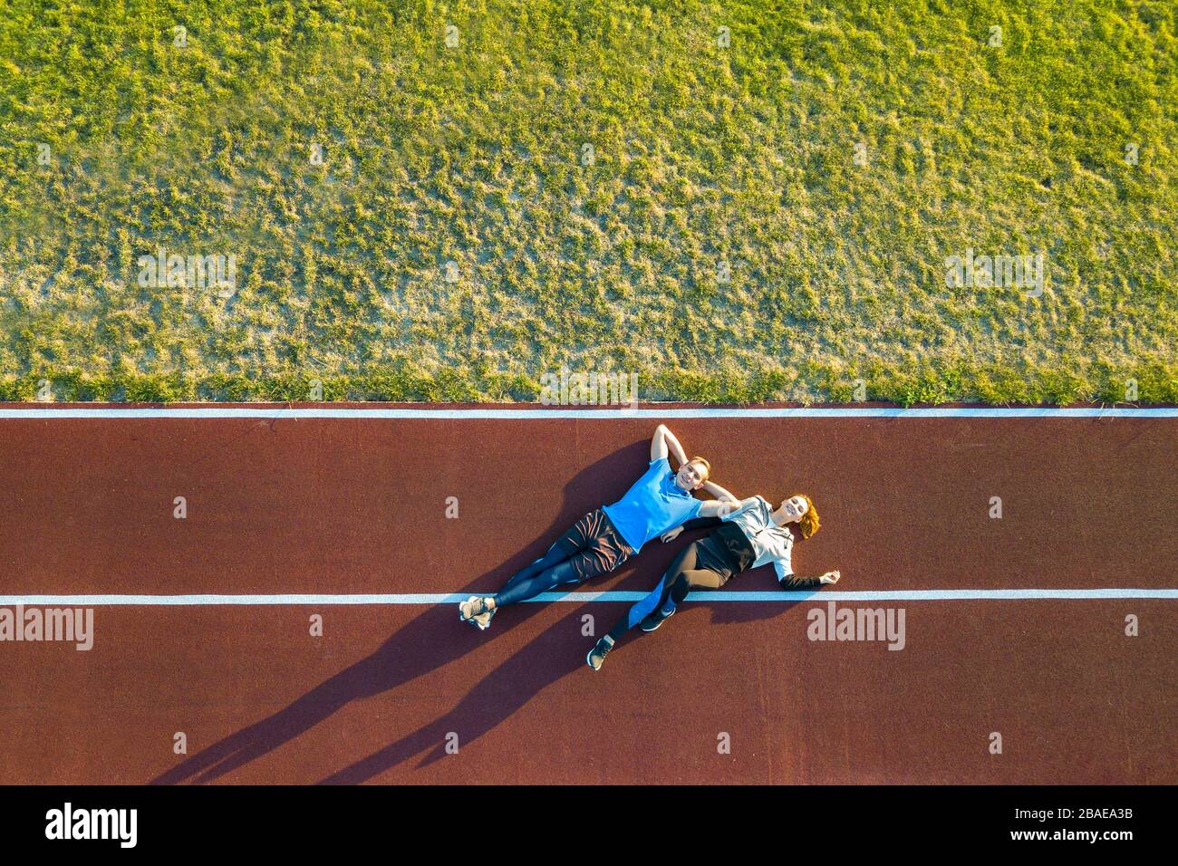 Top down aerial view of two young people sportsman and sportswoman ...