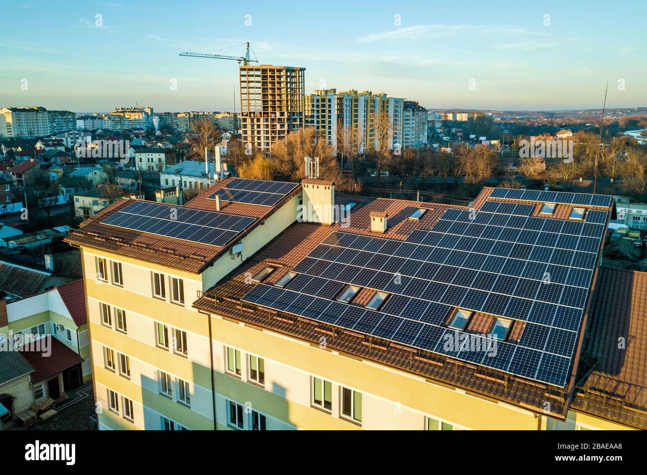 Aerial view of many photo voltaic solar panels mounted of industrial ...