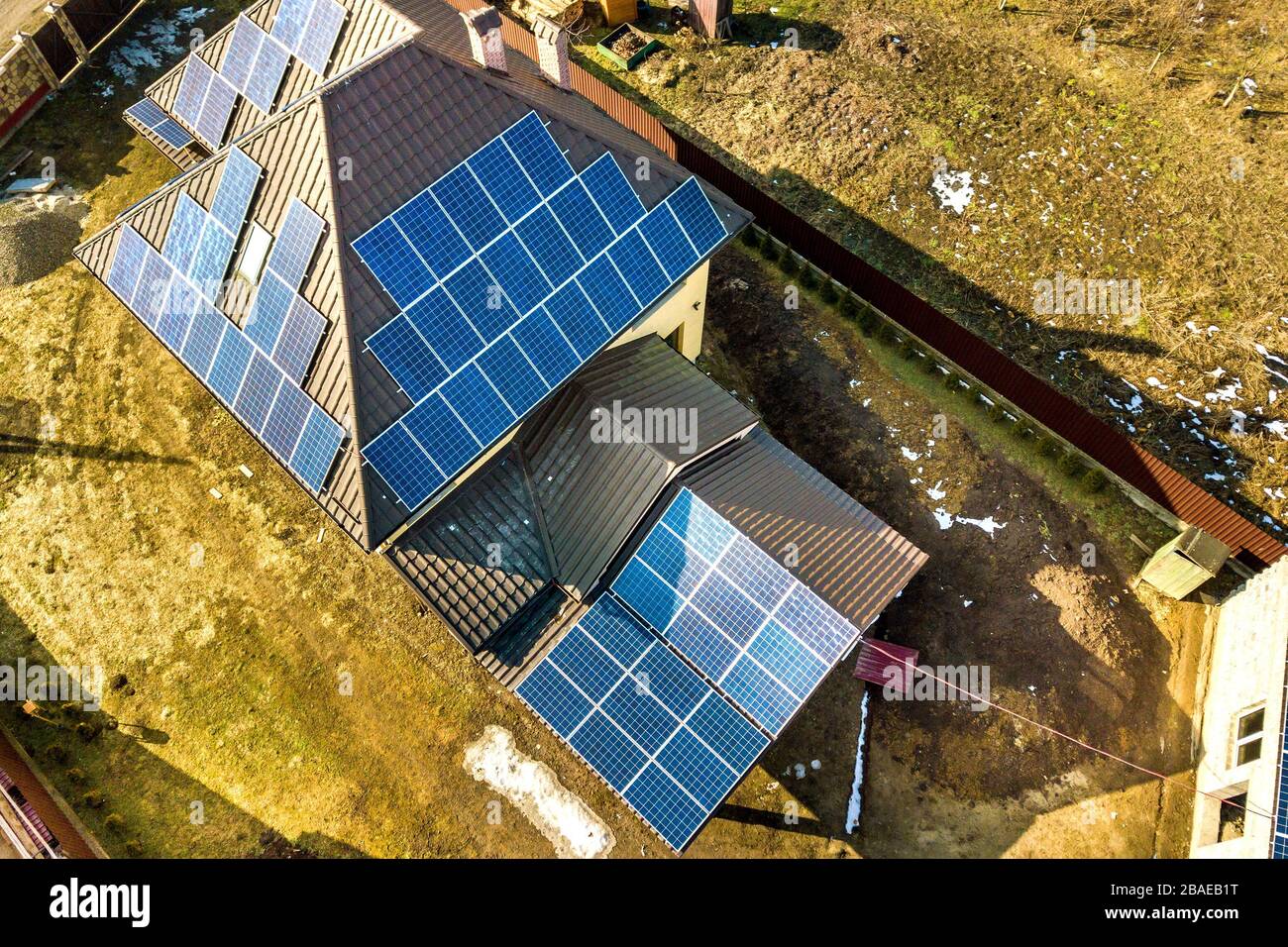 Aerial top view of new modern residential house cottage with blue shiny ...