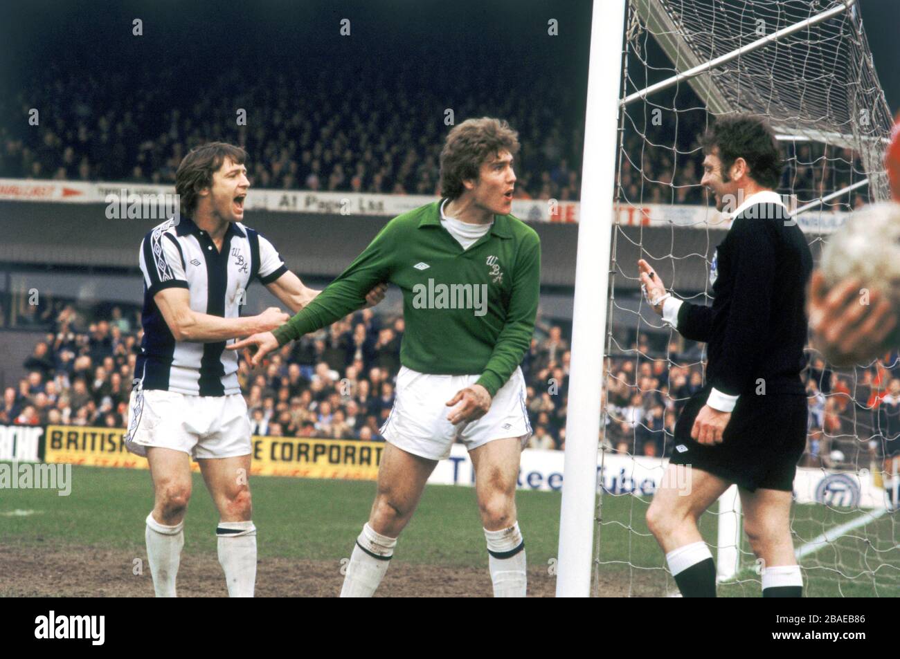 (l-r) West Bromwich Albion's Willie Johnston pulls goalkeeper Tony ...