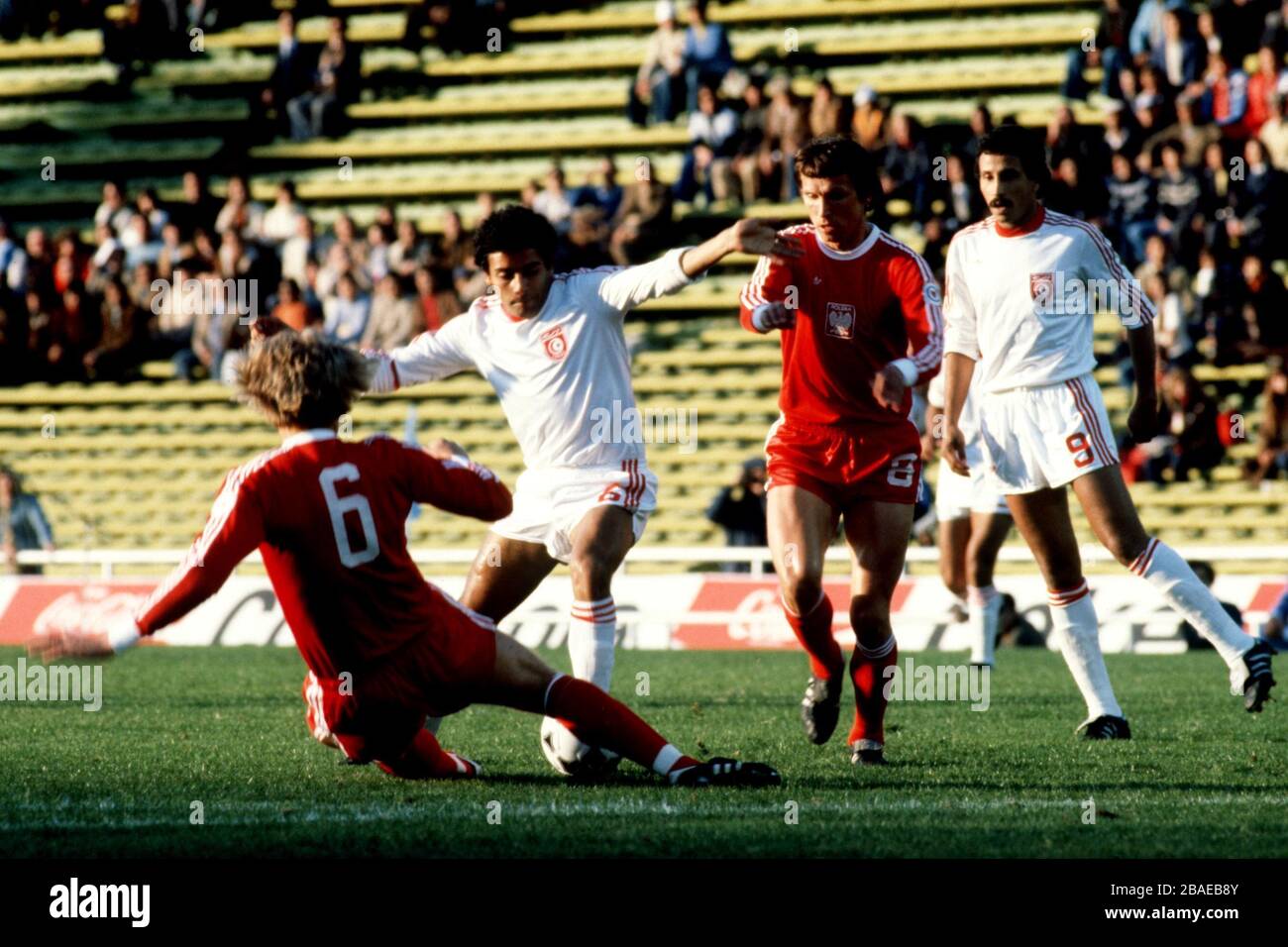 (L-R) Jerzy Gorgon (Pol) slides in to tackle Nejib Gommidh (Tun) as ...