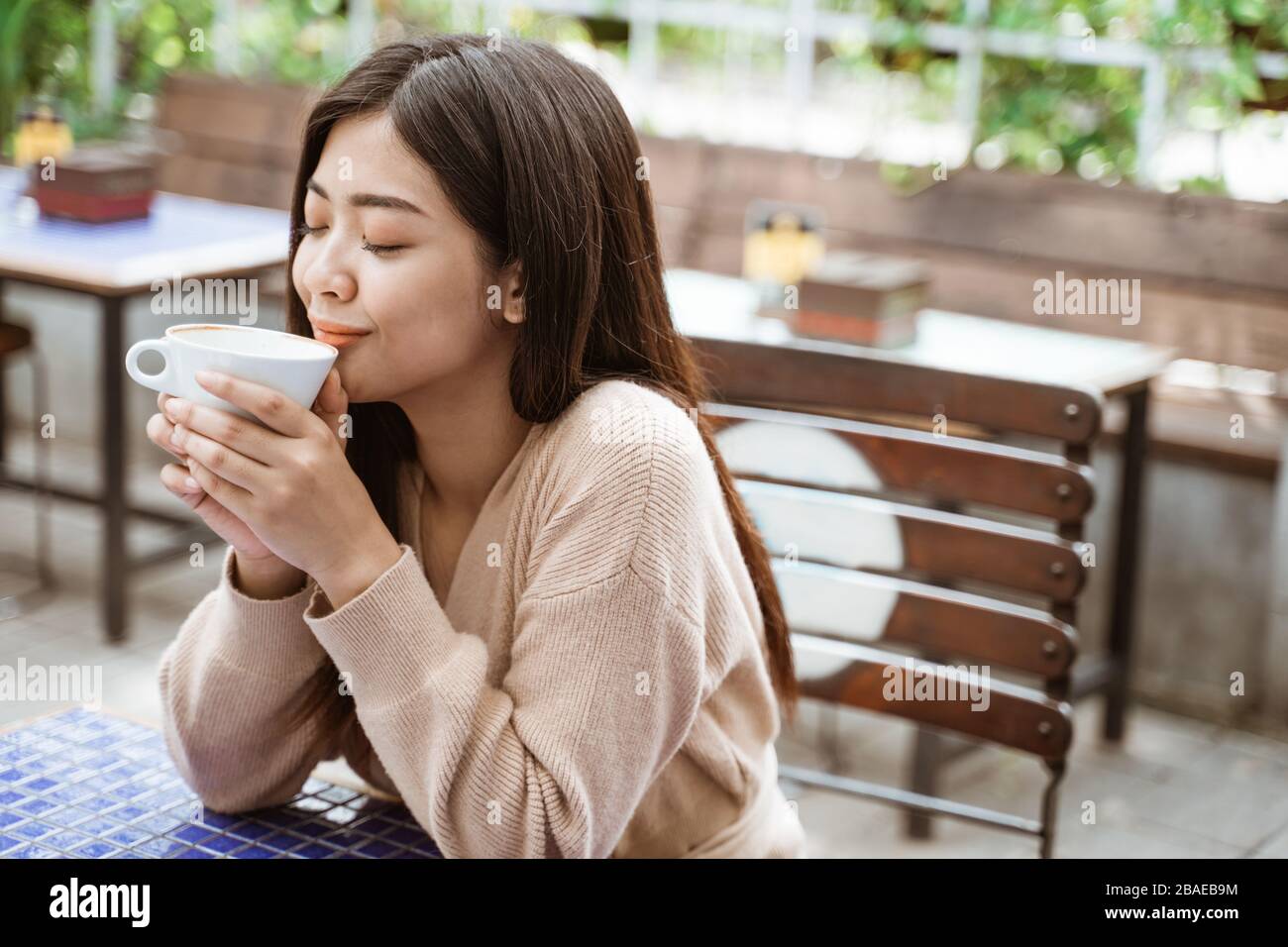 Girl herself in cafeteria hi-res stock photography and images - Alamy