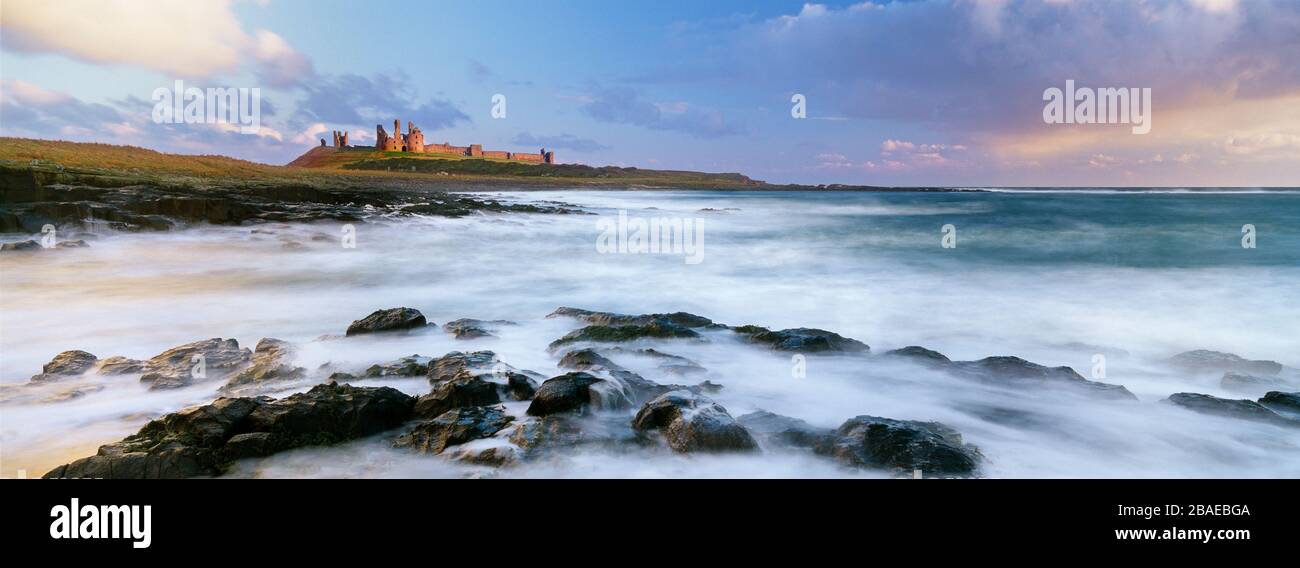 Dunstanburgh Castle across Craster Beach, Northumberland, England Stock ...