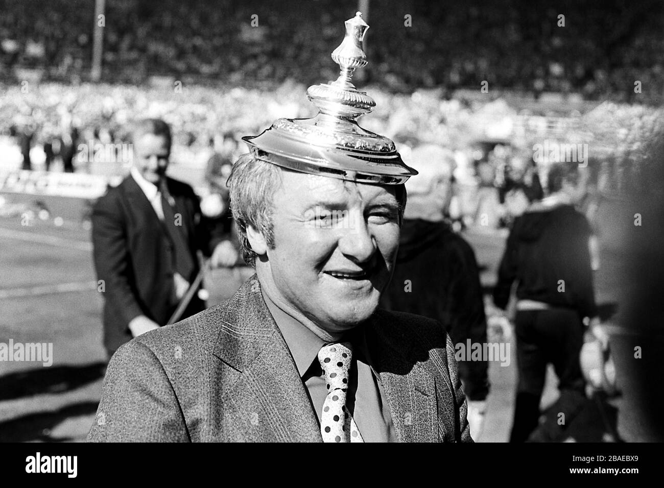 Manchester United manager Tommy Docherty celebrates with the lid of the ...
