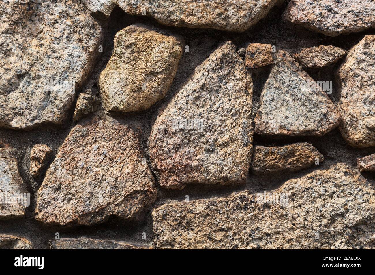 A stone wall reveals texture and the various shapes of rocks Stock ...