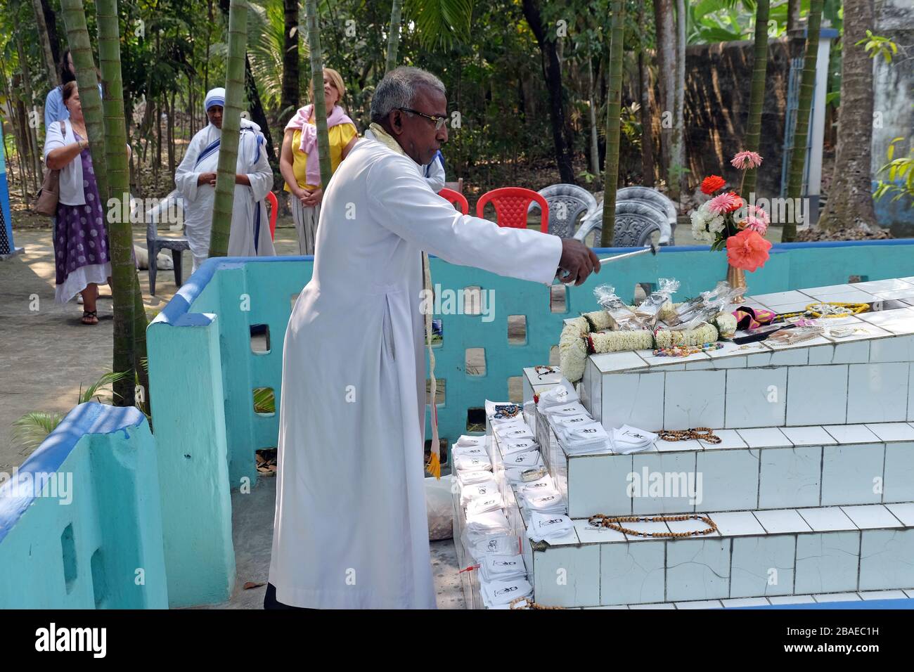The priest blesses religious objects at the tomb of a Croatian ...