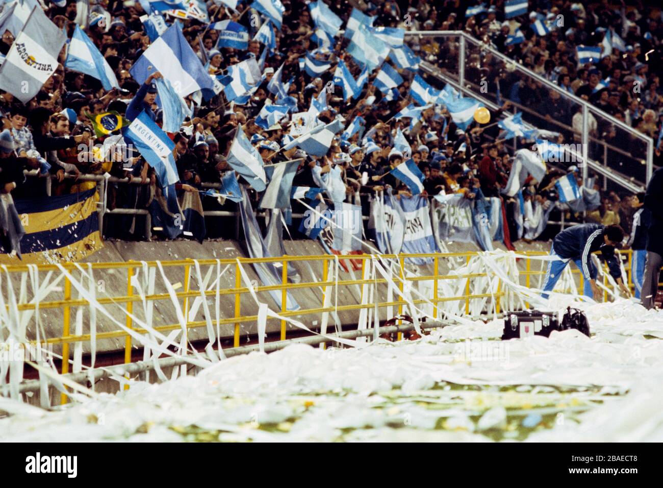 Argentina fans wave the national flag after showering the pitch with ...