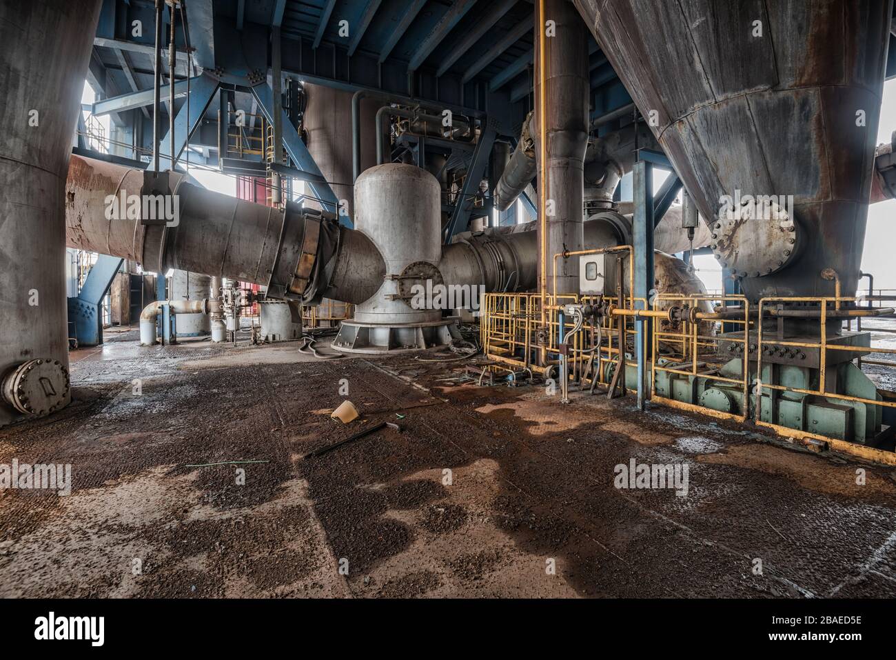 Interior of an old abandoned industrial steel factory Stock Photo - Alamy