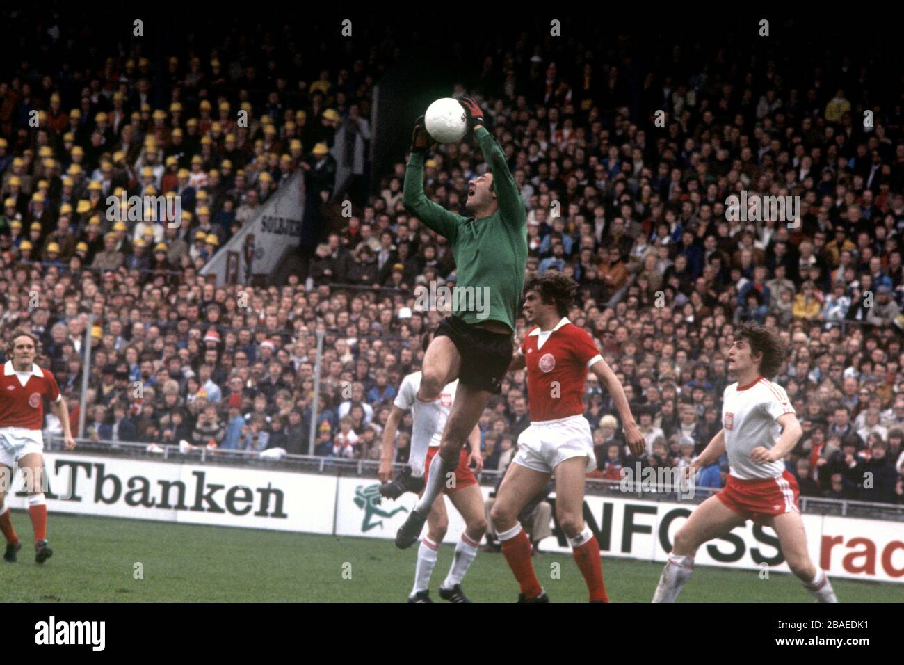 Poland goalkeeper Jan Tomaszewski claims a high ball ahead of Denmark's ...