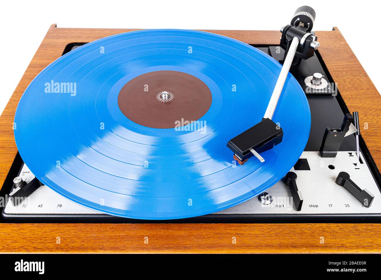 Vintage turntable with a blue vinyl isolated on white. Wooden plinth ...