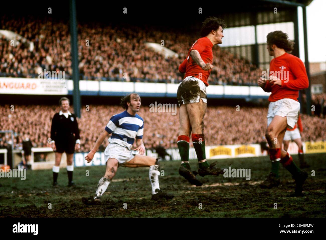 Queens Park Rangers' Terry Mancini (l) watches as Chelsea's Micky Droy ...