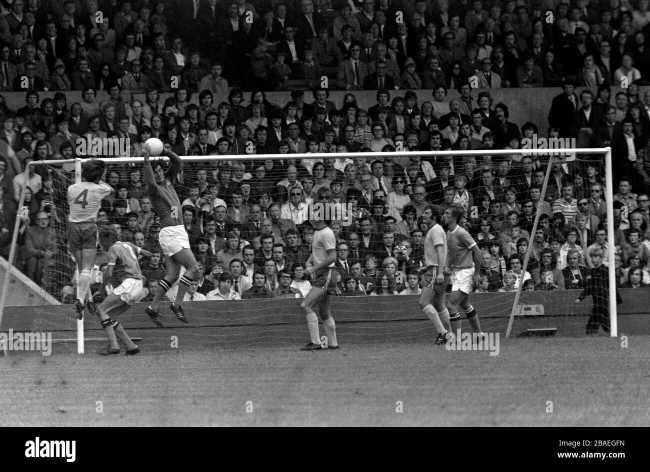Manchester City goalkeeper Joe Corrigan (third l) rises to claim a ...