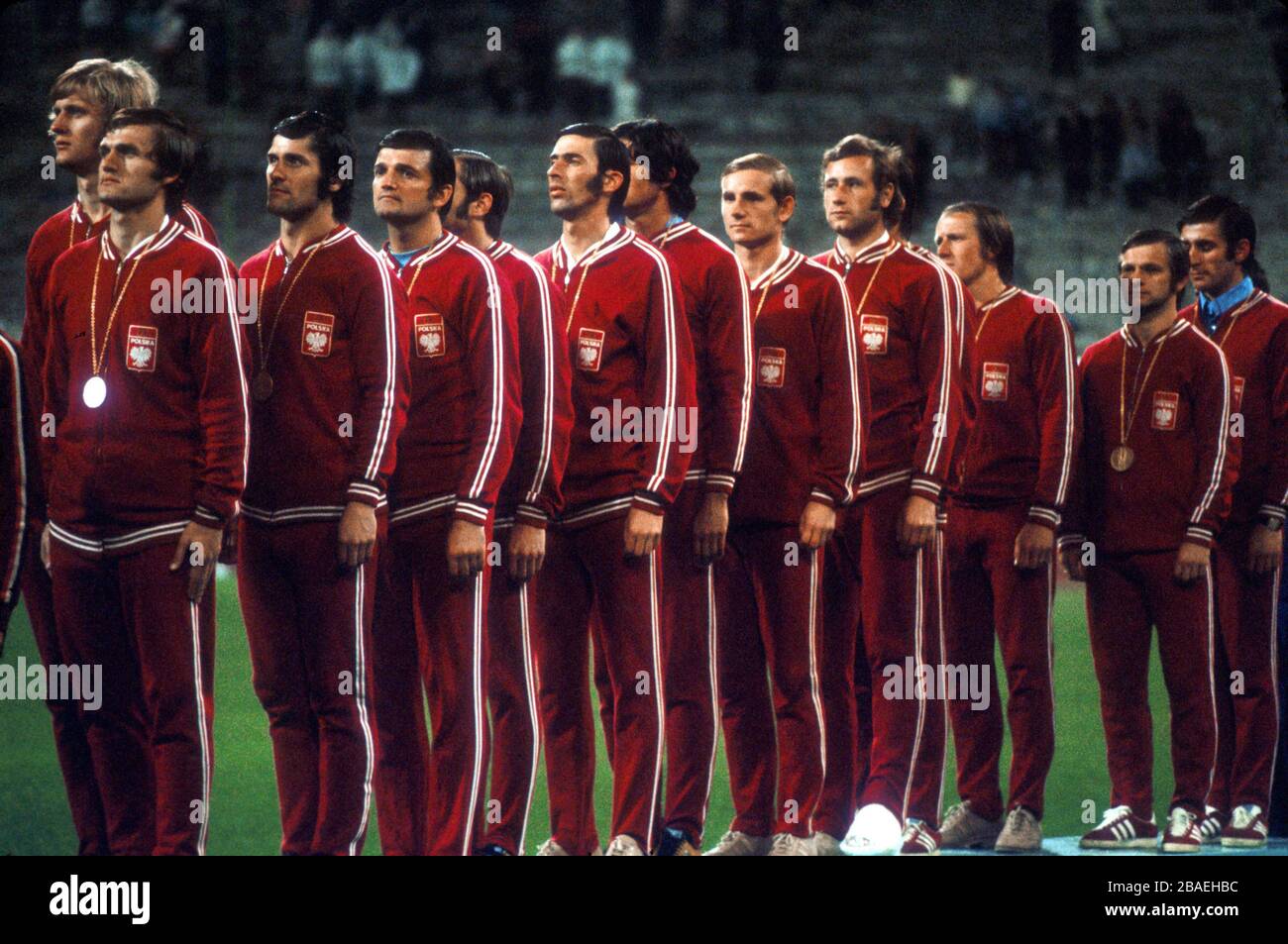 The Poland team line up with their gold medals to listen to the ...