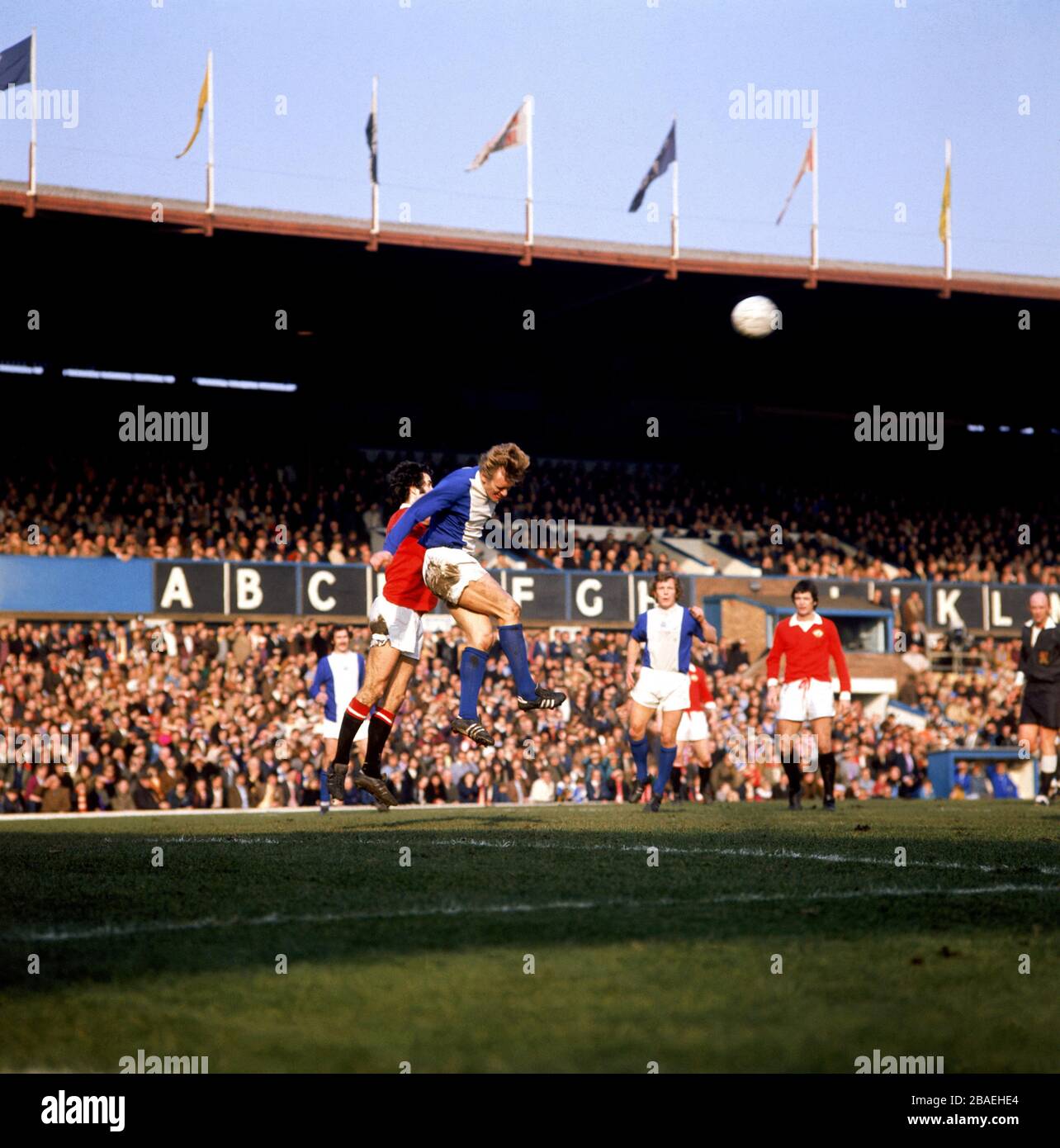 Birmingham City's John Roberts (r) beats Manchester United's Jim Holton ...