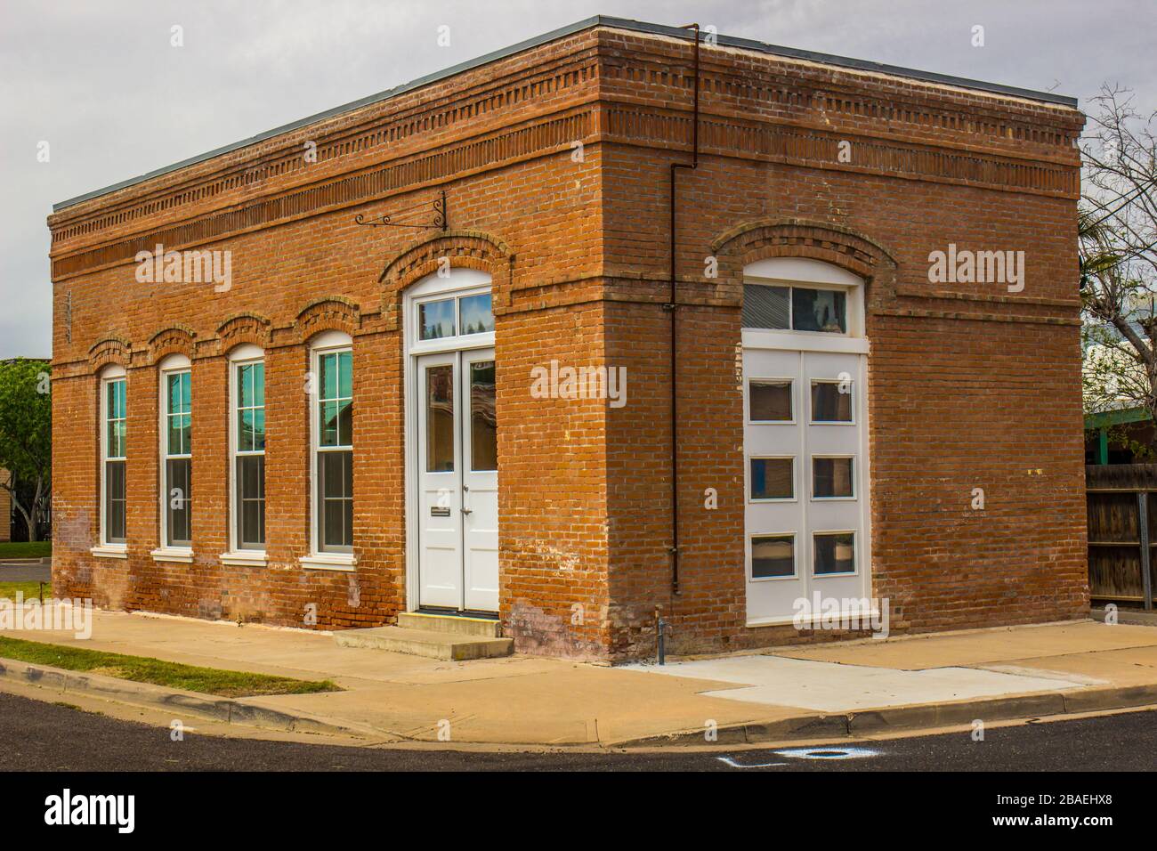 Old Brick Corner Building With Double Door Entry Stock Photo - Alamy