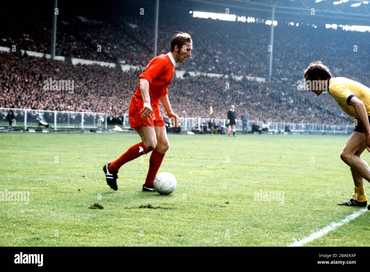 Liverpool's Peter Thompson (l) takes on Arsenal's Bob McNab (r Stock ...