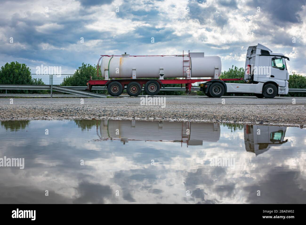 Tank truck with dangerous goods corrosive driving on the highway Stock ...