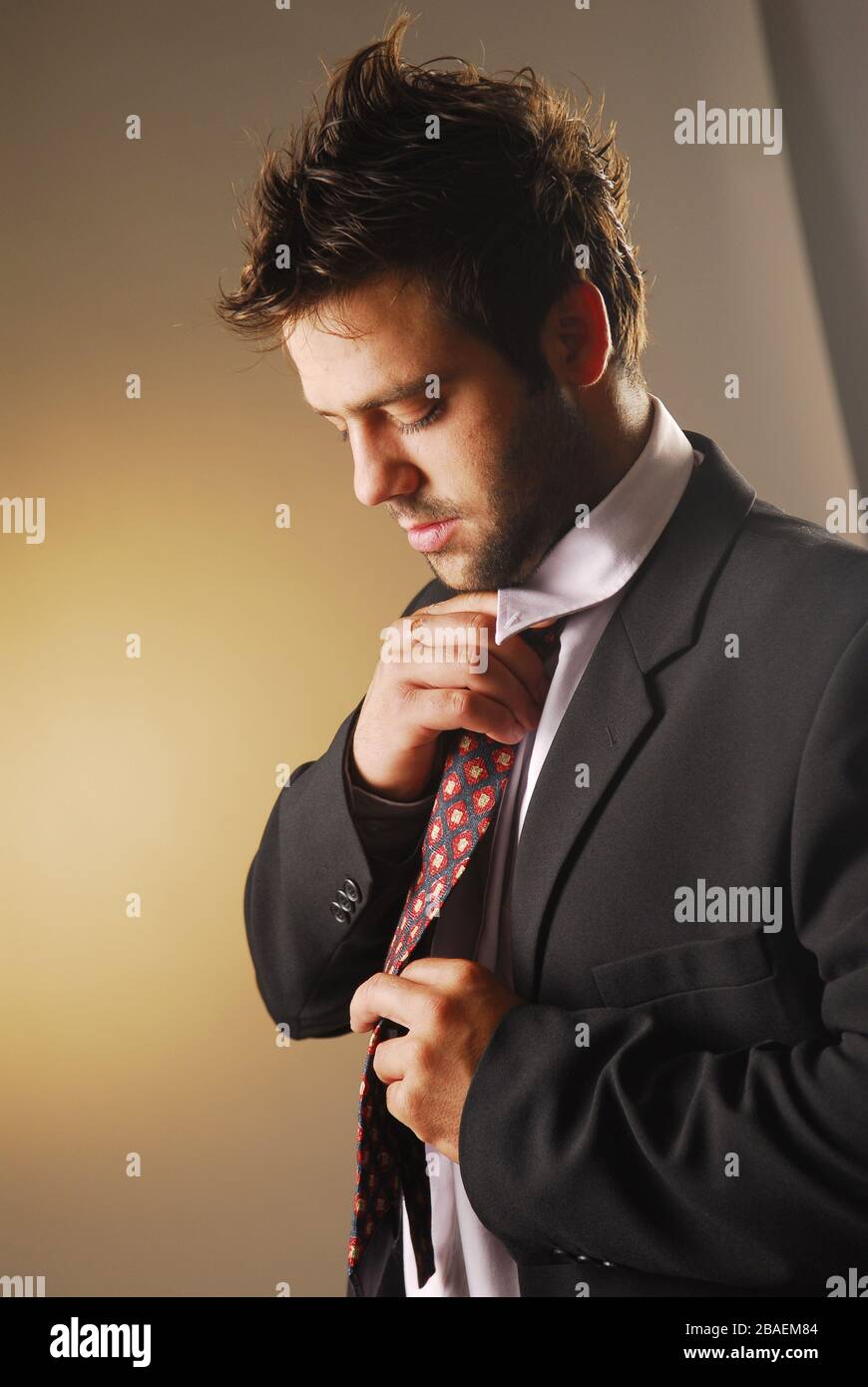 Knotting a tie hi-res stock photography and images - Alamy