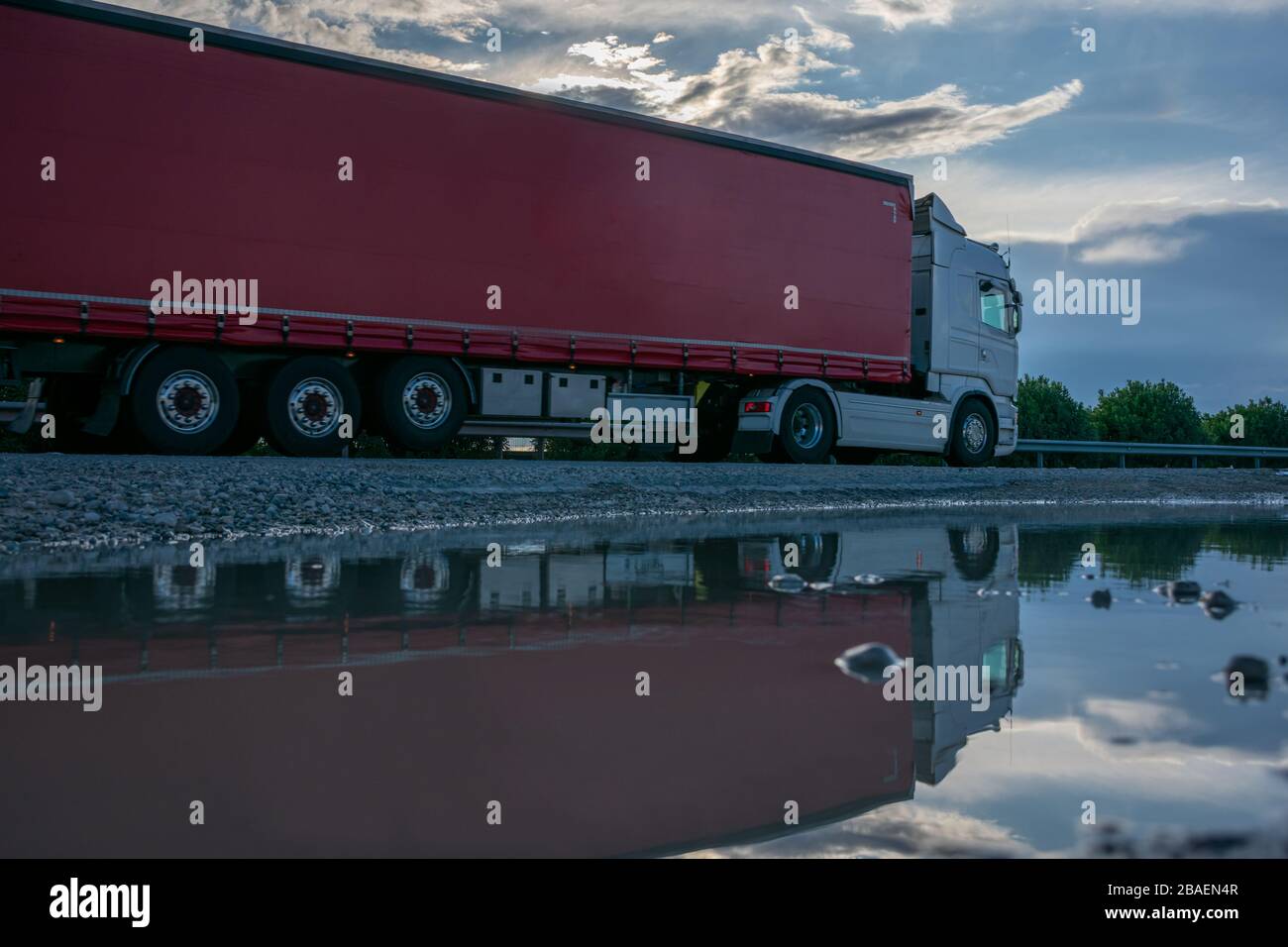 Truck with canvas semi-trailer with side opening for general transport ...