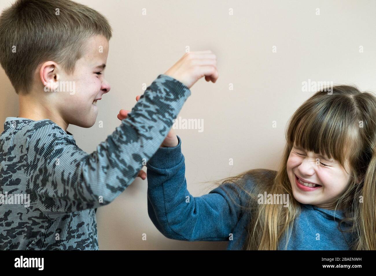 Two children boy and girl fooling around having fun together. Happy ...